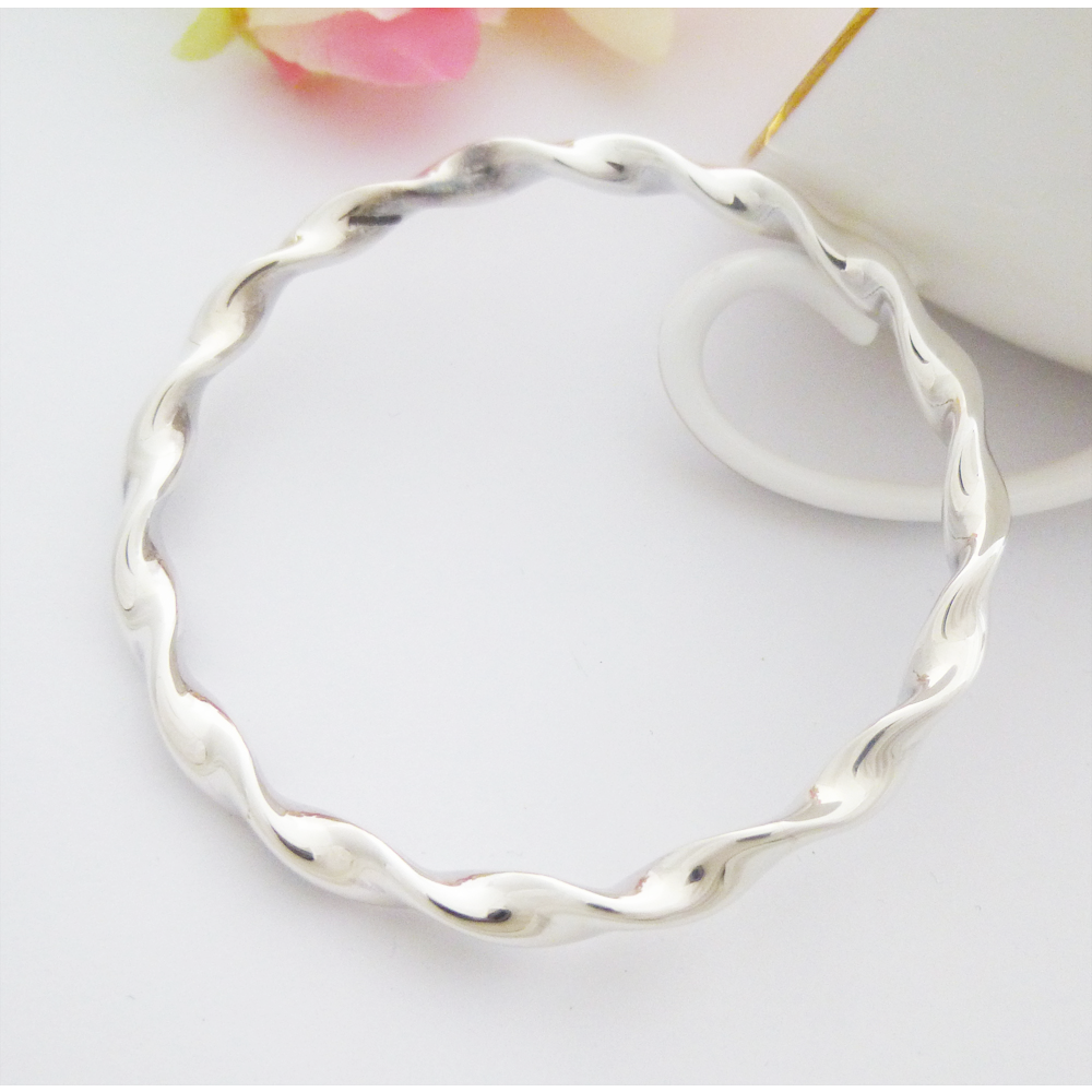 Contemporary Twist Solid Silver Bangle Hallmarked in the UK
