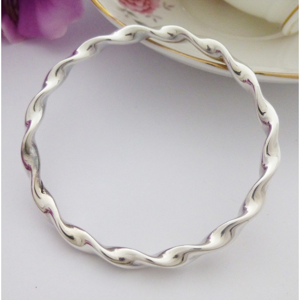 Contemporary Twist Solid Silver Bangle Hallmarked in the UK